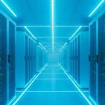 Futuristic data centre corridor with illuminated server racks representing high-performance digital infrastructure.